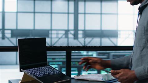 Technician In Data Center With Laptop And Tablet Integrating Ai Technology Stock Footage Video