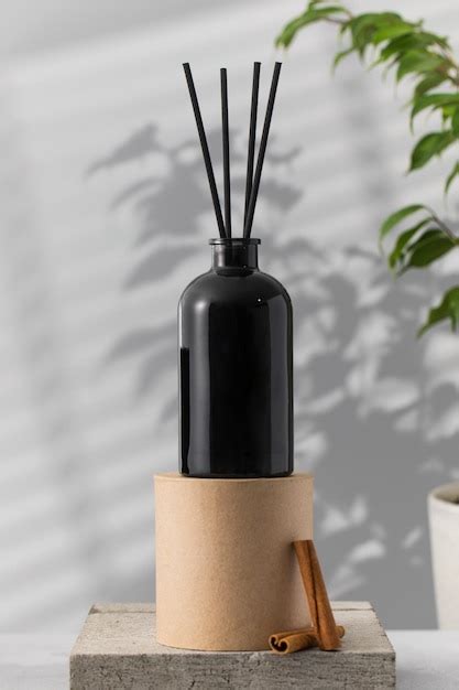 Premium Photo Bamboo Sticks In A Black Bottle With Cinnamonscented Room Perfume Diffuser With