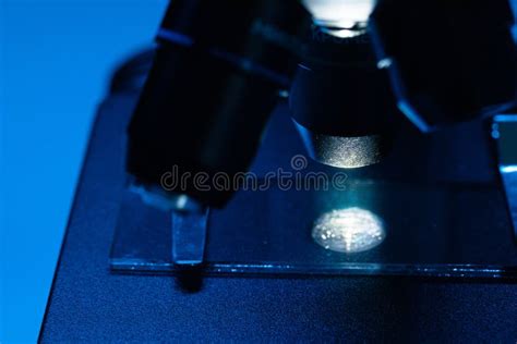 Microscope With Lenses Close Up Against Dark Background Stock Image