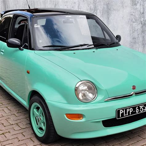 Vibrant Park Scene With Luxe Teal Model Car