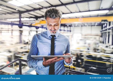 Portrait Of Project Manager Standing In Modern Industrial Factory