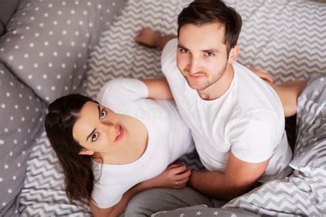 Intimate Sensual Young Couple In Bedroom Enjoying Each Other Stock