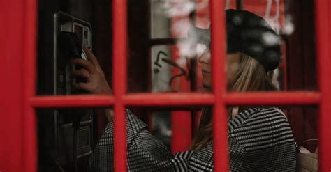 Woman Speaking With Somebody Inside A Phonebooth Free Stock Video