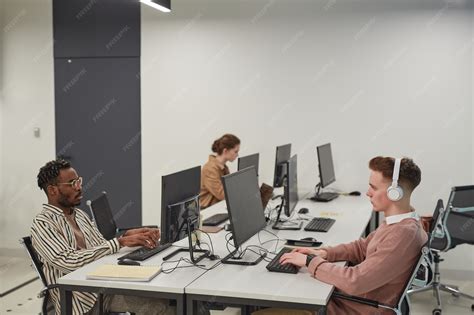 Premium Photo Wide Angle View At Group Of Young People Using