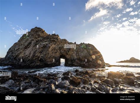 Rocky Keyhole Arch Sea Formation With Incoming Tide At Pfeiffer Beach