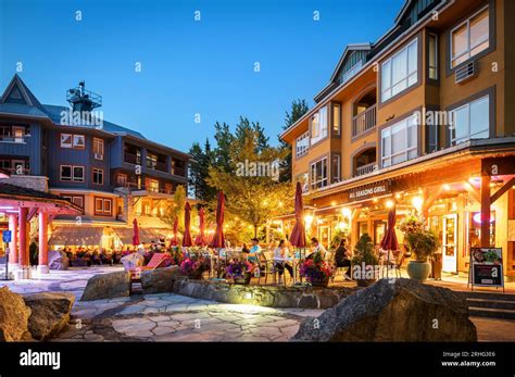 Tourists Dine Outside On A Summer Evening On Restaurant Patios In The