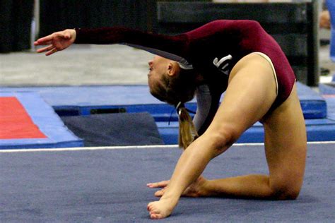 Gymnast A Gymnast Poses During Her Floor Routine During Th Flickr