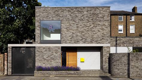 31 44 Architects Builds Grey Brick House Around Three Small Courtyards