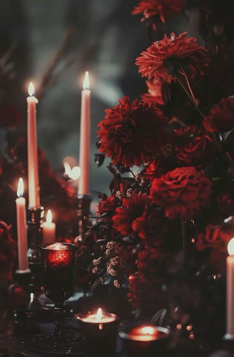 A Beautiful Arrangement Of White And Red Candles On An Altar