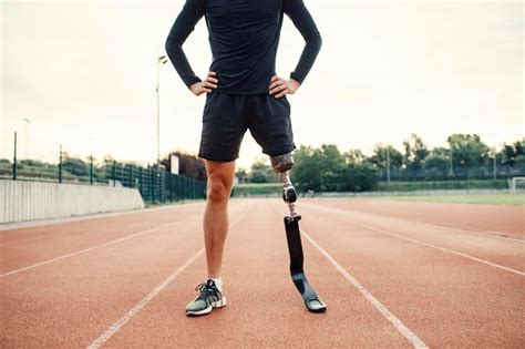 Premium Photo A Handicapped Runner Standing On Running Track At