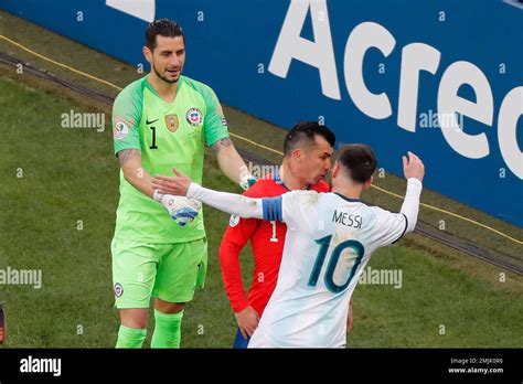 Argentinas Lionel Messi Right Confronts Chiles Gary Medel Center