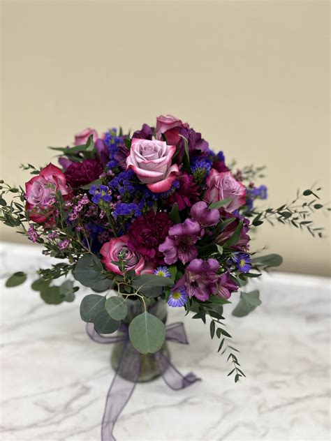 Purple Status Wax Alstroemeria Roses Aster And Other Greenery In Riverhead Ny La