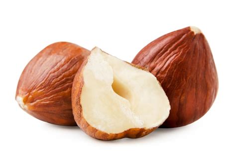 Premium Photo Hazelnut Whole And Half On A White Background Isolated