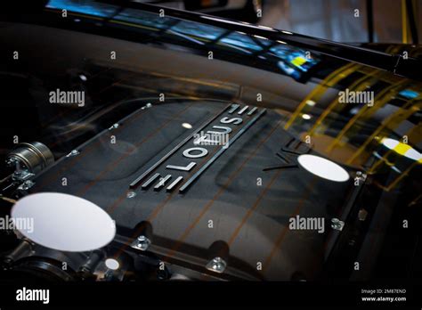 A Closeup Of The 6 Cylinder Engine Of The Lotus Automobile Under Glass