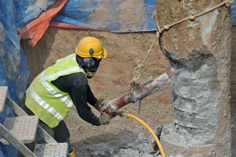 Construction Workers Using Concrete Hacker At The Construction Site Stock Image Image Of