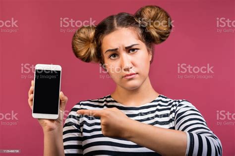 Frustrated Hipster Girl Pointing Finger At Blank Screen Mobile Phone