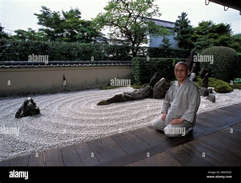Japanese Buddhist Monk Sitting On The Veranda Of Zuiho In Temple With