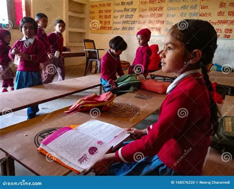 Indian School Girl Presenting Book At Class Room In India January 2020