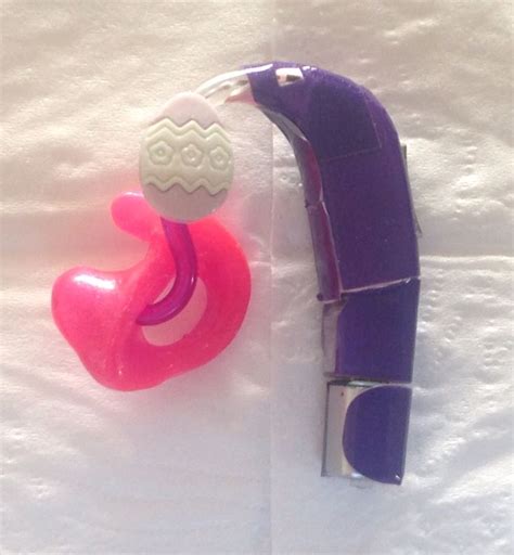 Pink Oticon Hearing Aids With Sparkly Purple Nail Foils Which Is Also