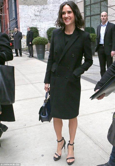 Jennifer Connelly Flashes Her Trim Pins In Black Wool Coat And Sandals