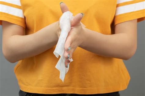 Premium Photo Girl Rubs Her Hands With An Antibacterial Sanitary