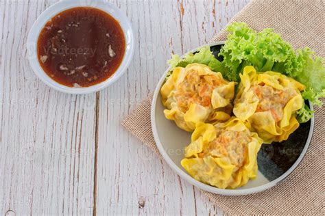 Chinese Steamed Dumpling Shumai On White Dish Served With Soy Sauce And