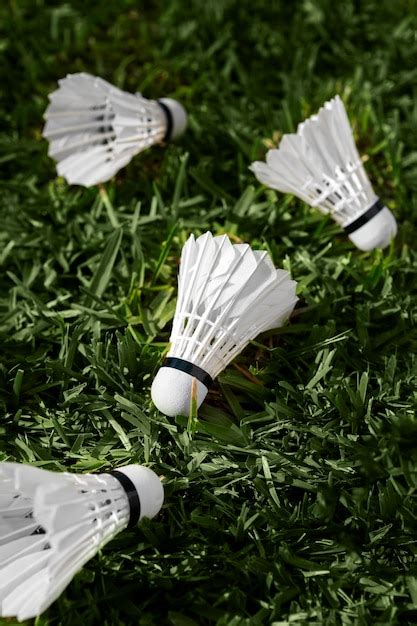 Free Photo Badminton Shuttlecocks On Grass High Angle