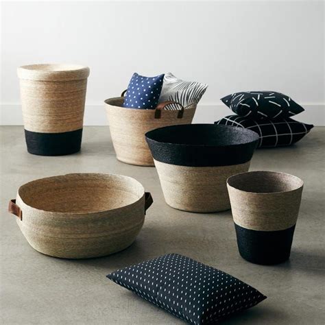 Various Bamboo Baskets And Grey Throw Pillows For Stylish Home Decor