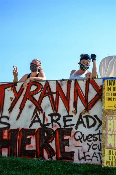 Unrecognizable Women Making Two Fingers Gesture While Protesting