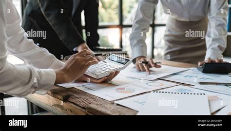 Economic Business Discussions Business Team Analyzing Income Charts