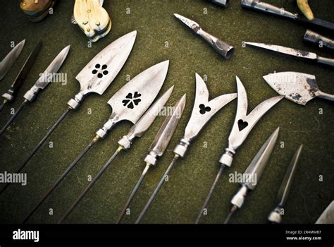 Detail Of Arrow Heads Hand Forged By A Blacksmith Displayed On A Table