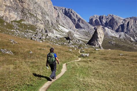 A Tourist Hiking In Val Di Gardena In The Dolomites 66097686 Stock