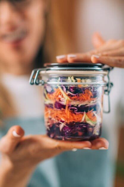 Premium Photo Vegetable Fermentation Woman Holding Jar With Fermented