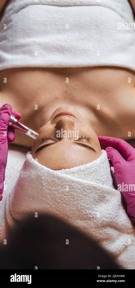 Beauticians Hands Using Dermapen Making Mesotherapy Injection On Woman