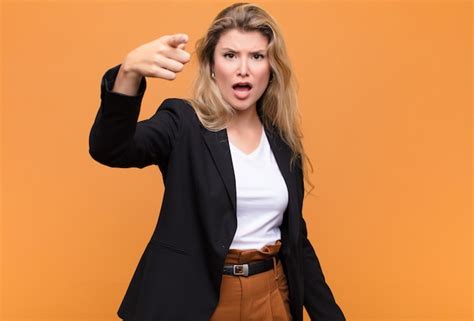 Premium Photo Pointing At Front With An Angry Aggressive Expression