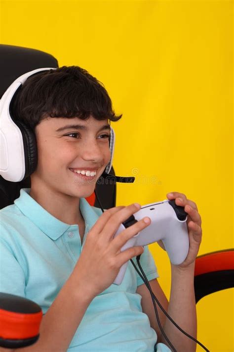 Video Games Preteen Boy With Headset With Microphone And Video Game