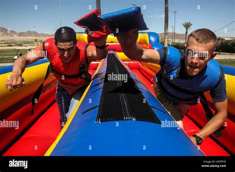 Left To Right Us Navy Hospital Corpsman 3rd Class David Cagua And Pfc