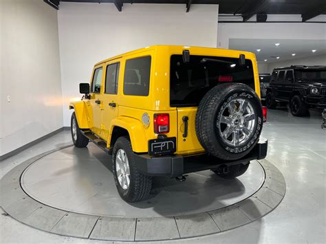 Used 2015 Baja Yellow Clear Coat Jeep Wrangler Unlimited Sahara 4x4