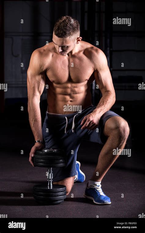 Portrait Of Young Attractive Caucasian Muscular Man Working Out In Gym