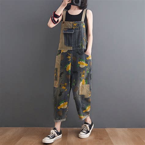 秋季宽松大码卡通印花牛仔背带裤女显瘦减龄吊带连体裤休闲垮裤潮虎窝淘