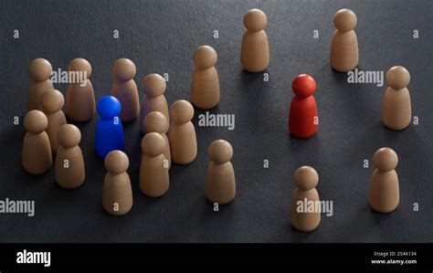 Introvert And Extrovert Concept Wooden Figurines On A Desk Economic Status And Social