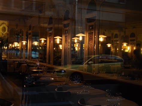 Premium Photo Reflection Of Car On Restaurant Window At Night
