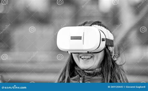 Happy Woman Wearing A Virtual Reality Visor Exploring The City