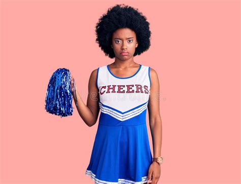 Young African American Woman Wearing Cheerleader Uniform Holding Pompom