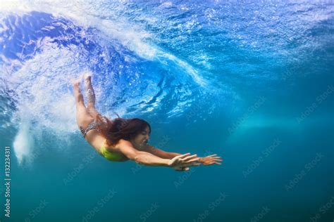 Young Sportive Girl In Bikini In Action Fit Woman Swim Underwater
