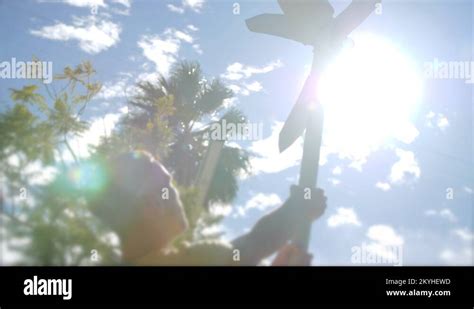 Man With An Wind Propeller Craft In A Windy Day Wind Energy Concept