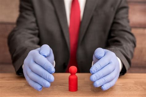 Premium Photo Businessman With Figurine At Table