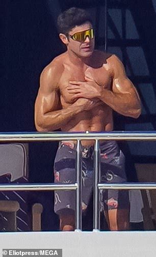 Zac Efron Shows Off His Chiseled Abs As He Goes Shirtless On A