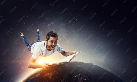 Premium Photo Young Joyful Man Levitating In The Sky Mixed Media