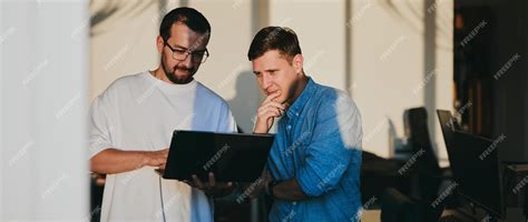 Premium Photo Portrait Of Two Professional Male Programmers Working